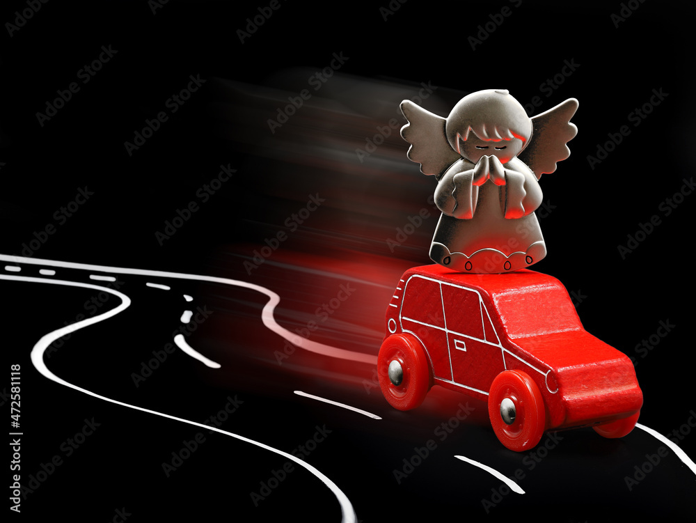 Guardian angel protects red car in road traffic, concept image on black ...