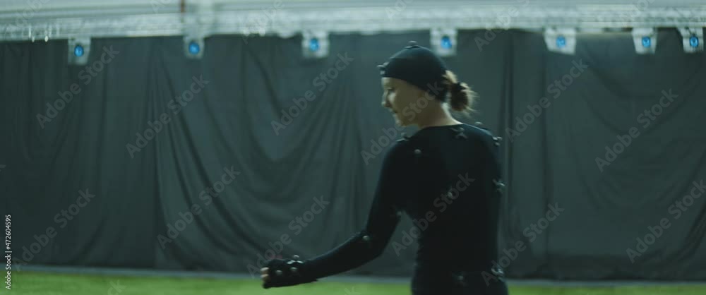 Actors wearing motion capture suits performing some fight moves as game ...