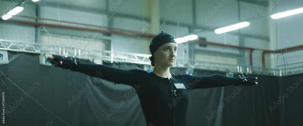 BTS of filmmaking. Female actor is standing in T-pose for calibrating ...