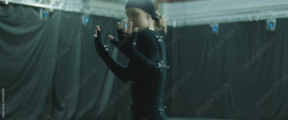 Actors wearing motion capture suits performing some fight moves as game ...