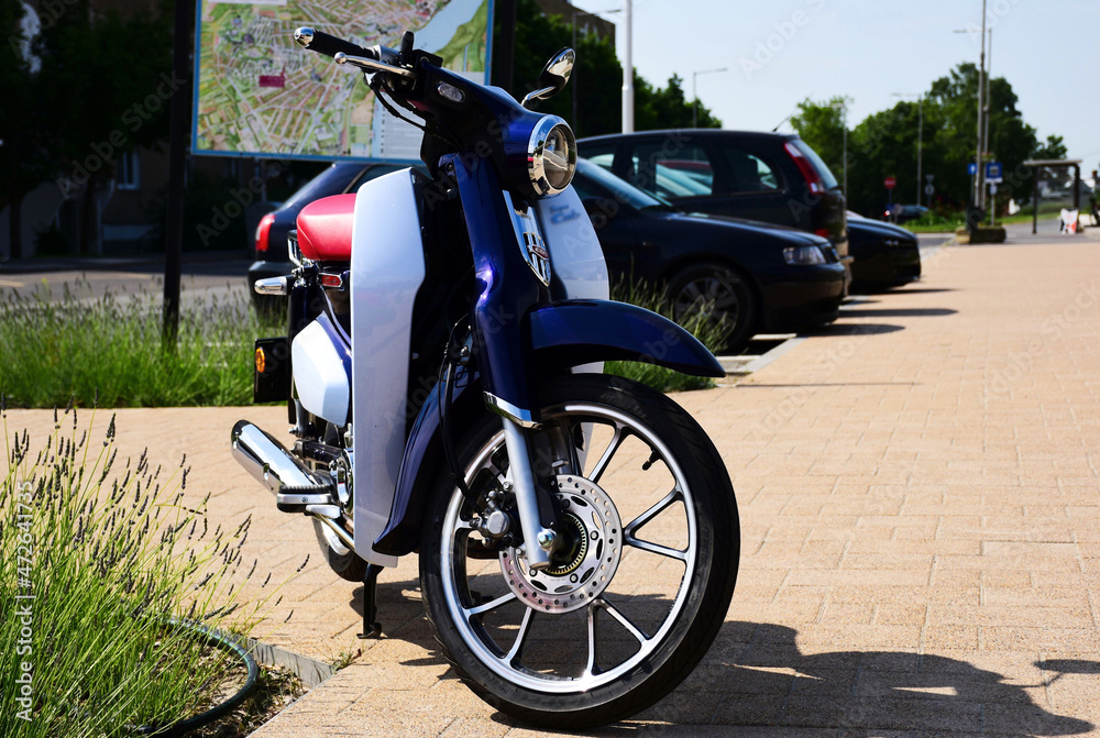 Modern electric motor bike or scooter. Frontal view. Aluminum wheel ...