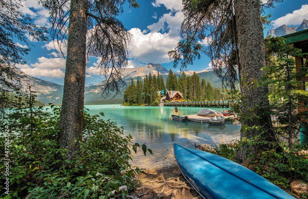 Blue canoe on shore of Emerald lake in Yoho National Park, Canada ...