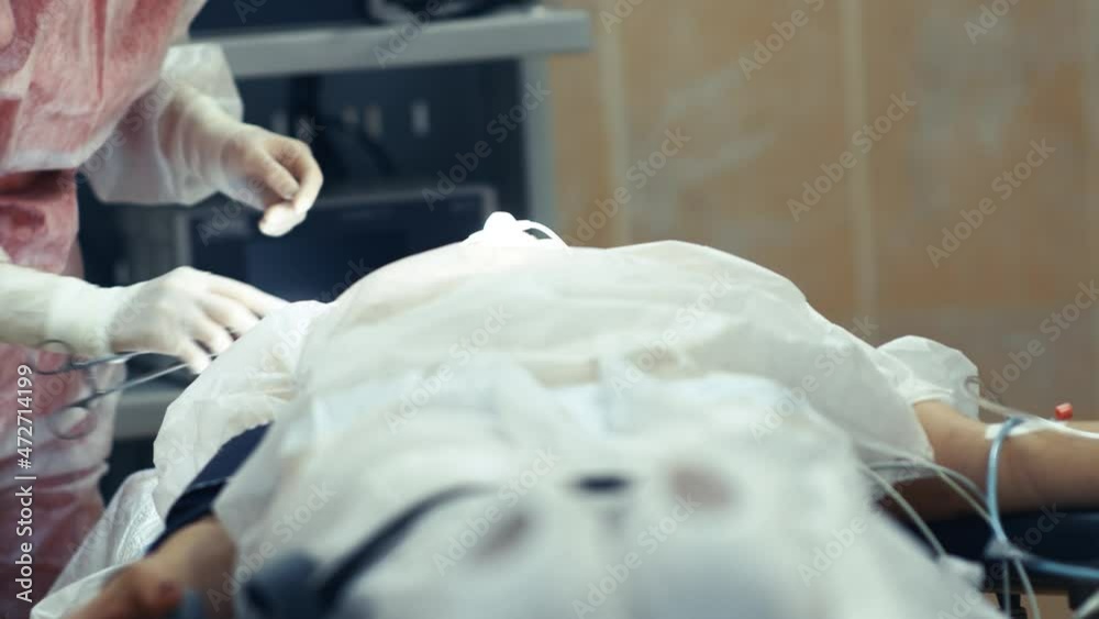 treatment of the patient's skin in the operating room with iodine ...