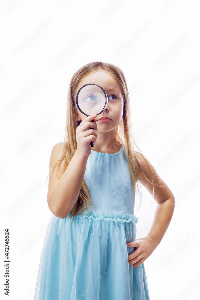Little girl child looking through a magnifying glass, isolated on white ...