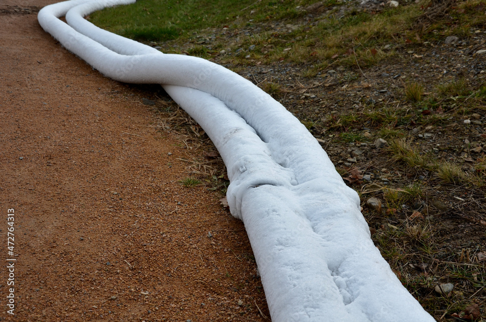 cooling register of pipes under the ice surface. rows of frozen tubes ...