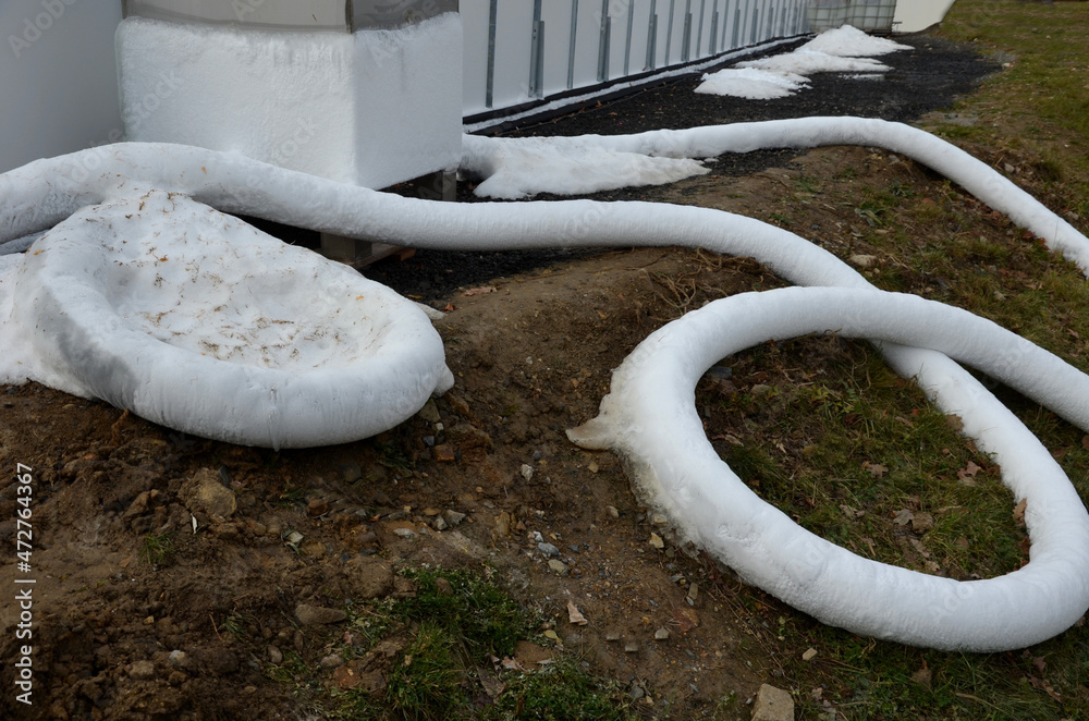 cooling register of pipes under the ice surface. rows of frozen tubes ...