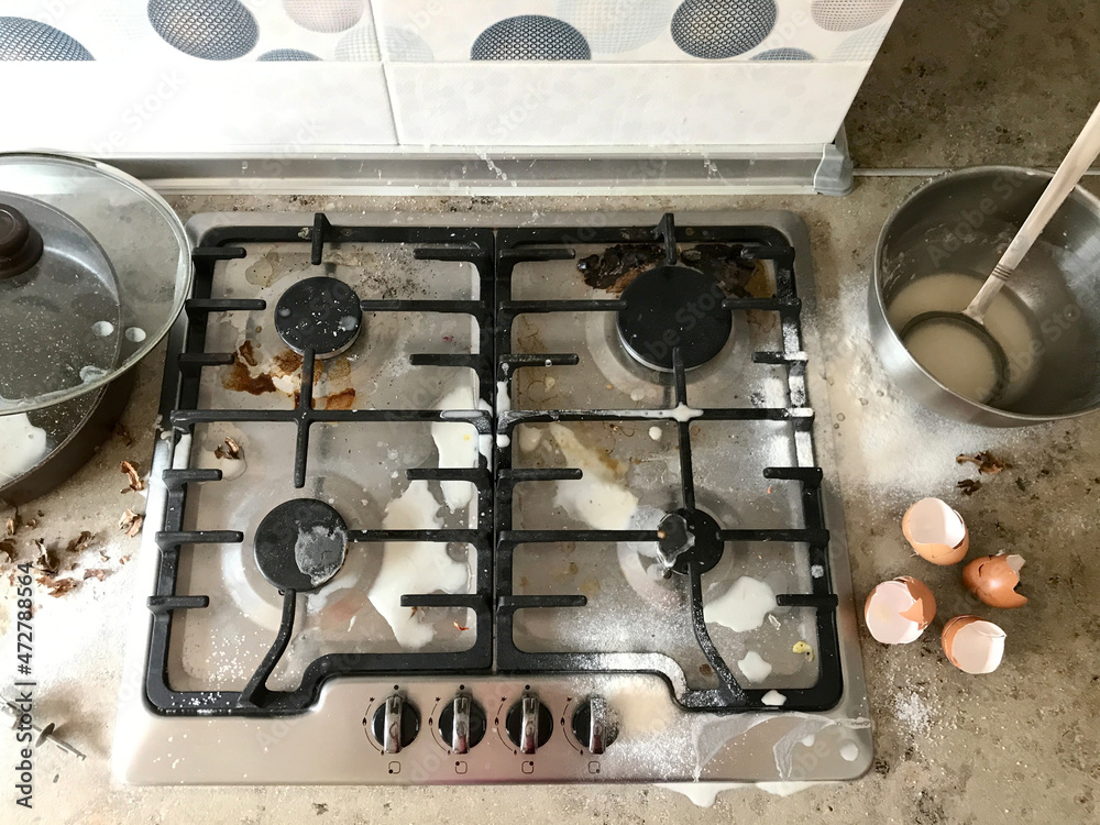 A scruffy and dirty kitchen, a stove in grease. Unsanitary condition, a ...