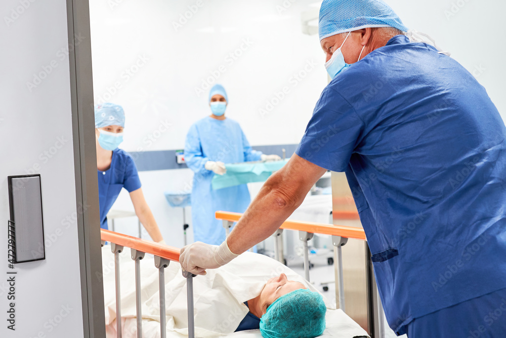 Two nurses push the patient in the hospital bed Stock Photo | Adobe Stock