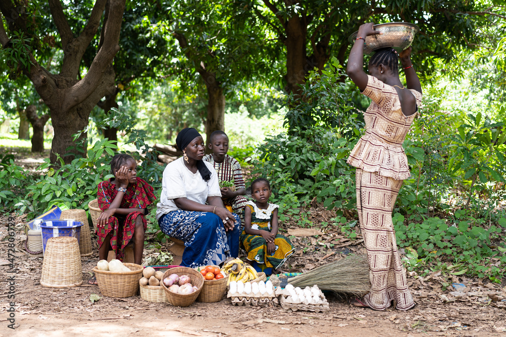Typical African street market scene with black women and children ...