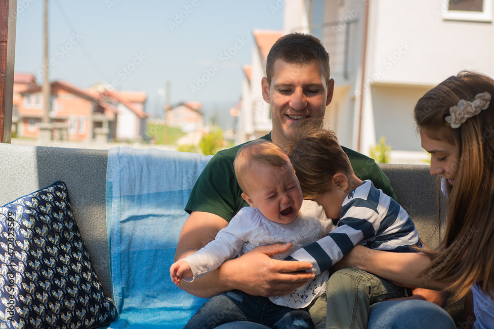 Brother is hugging his crying sister Stock Photo | Adobe Stock