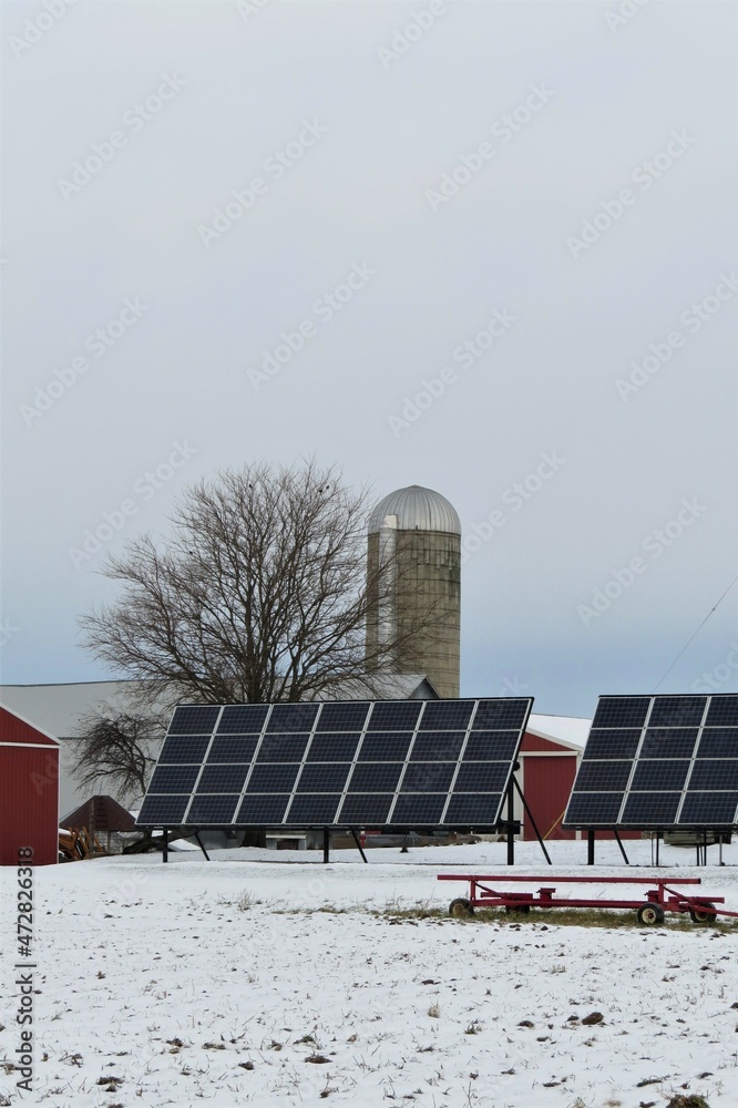 Solar Panels on Country Farm in Front of Red Barns and Silo and Bare ...