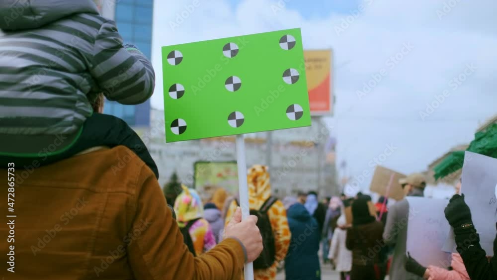 Father and son on political picket with empty banner, blank placard ...