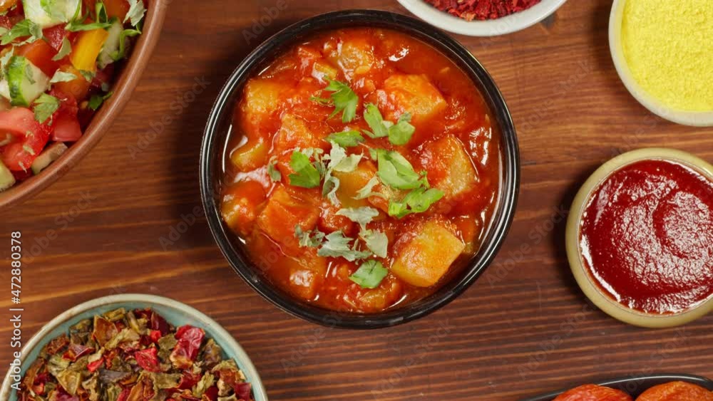 Baked eggplant, vegetables in tomato sauce, vegetarian food. Middle ...