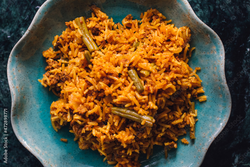 Lubia polo Persian rice dish with ground beef, green beans, turmeric ...