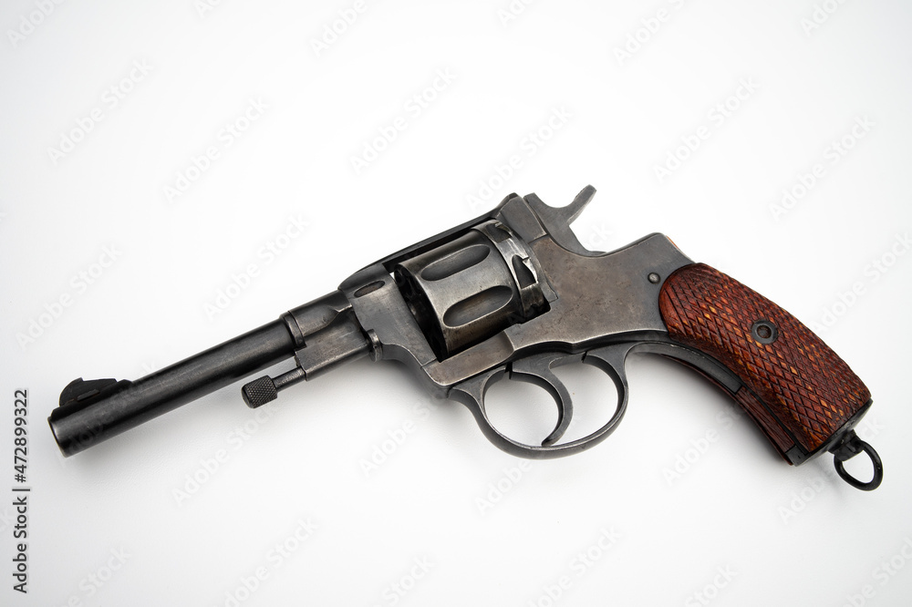 A revolver pistol of the nagant system on a white isolate. The weapon ...