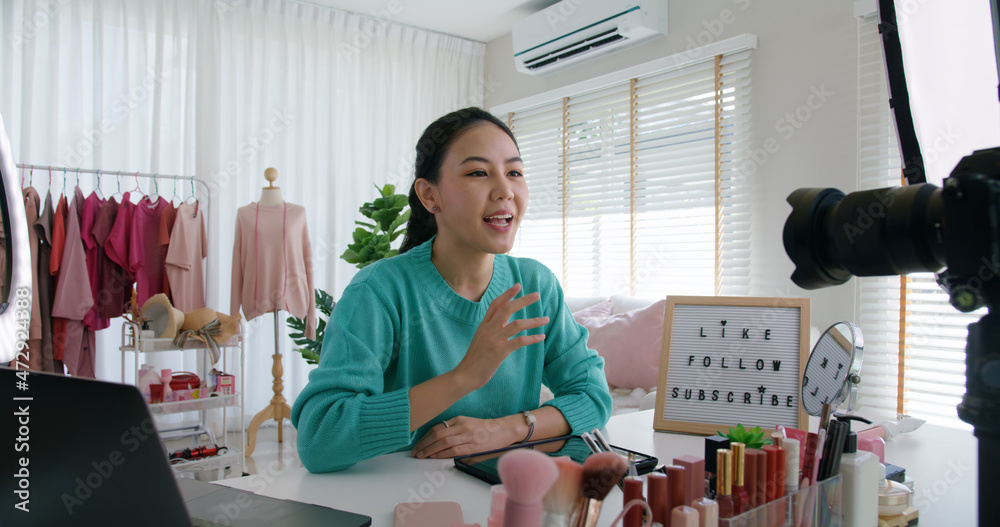 Asia woman micro influencer record live viral video camera at home ...