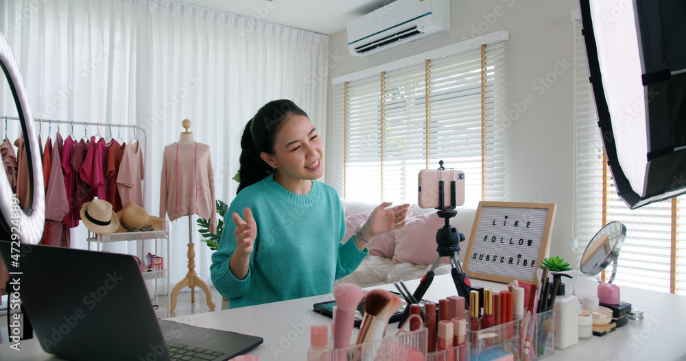 Asia woman micro influencer record live viral video camera at home ...