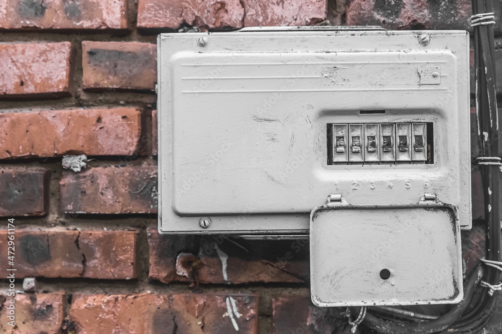 The old broken electrical panel or box of the drawer on the wall ...