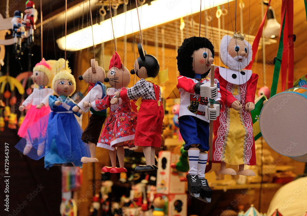 Traditional wooden puppet toys hang at a market stalls in Prague, Czech ...