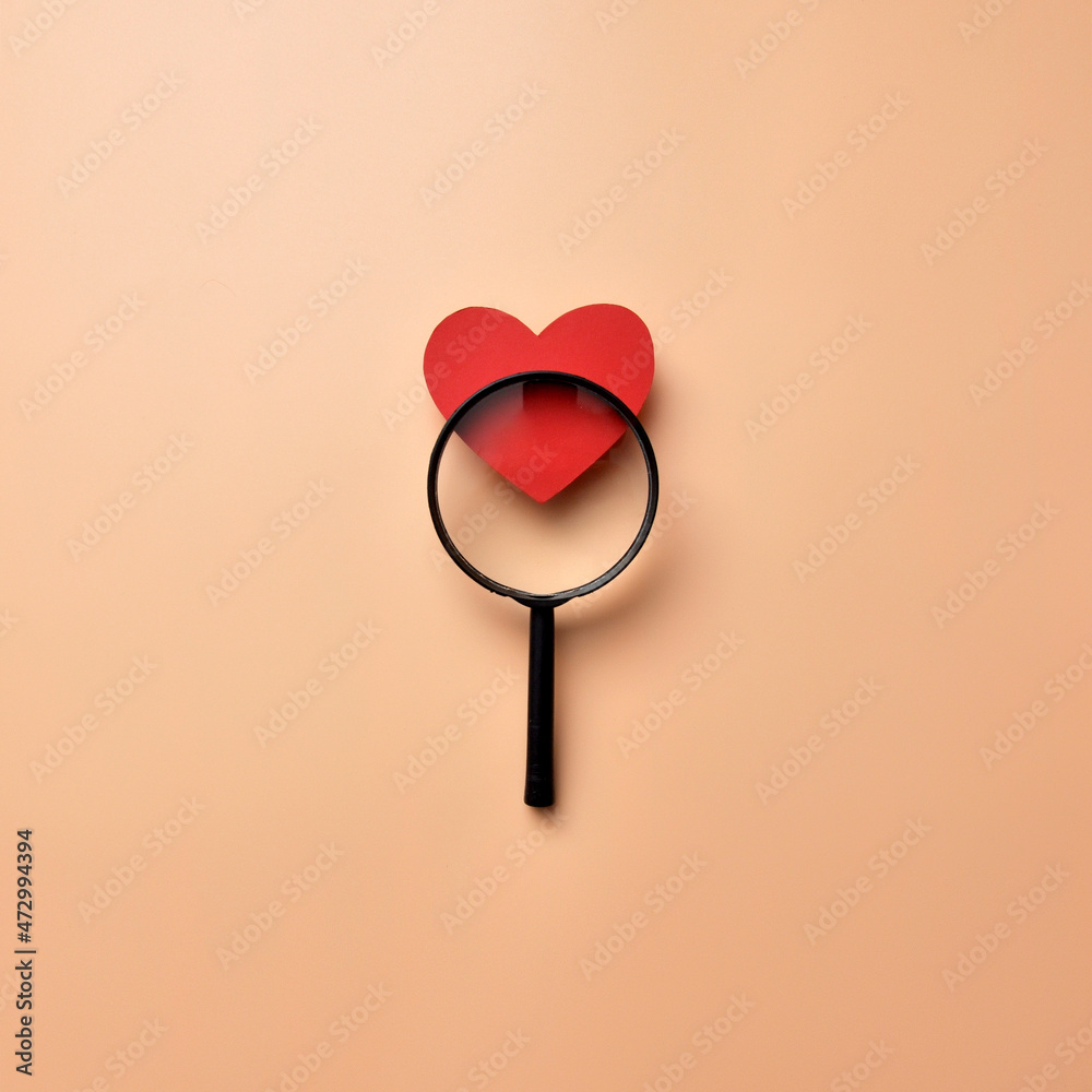 Red heart and magnifying glass. The symbol of the search for love Stock ...