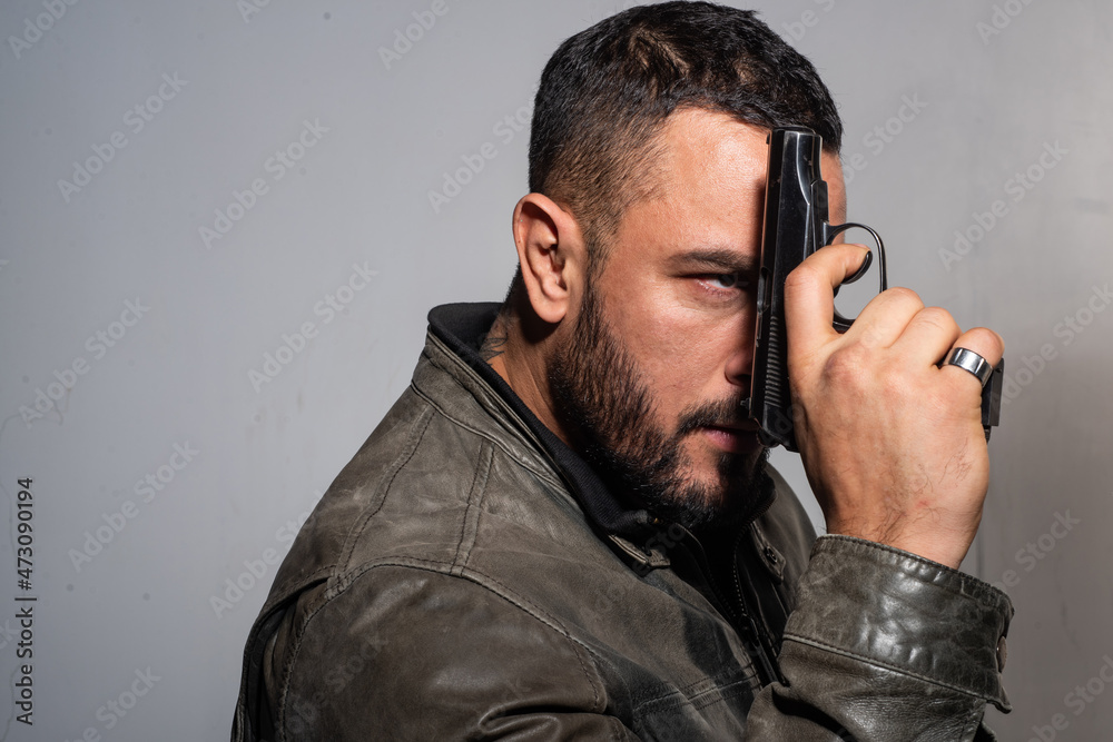 Fotka „Man firearm handgun, makarov pistol in a firing range. Gangster ...