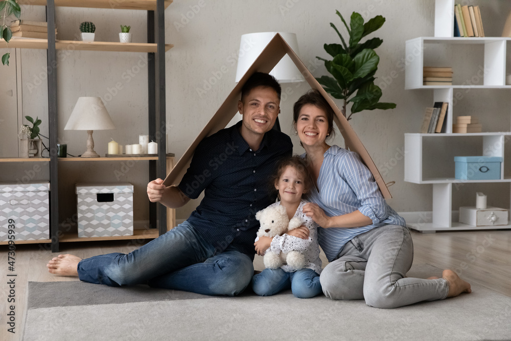 Happy millennial family couple and cute daughter kid with toy holding ...