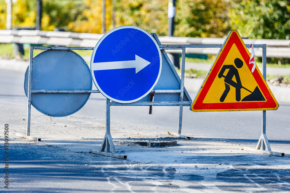 Road signs!Road works with trucks and traffic signs.road works road ...