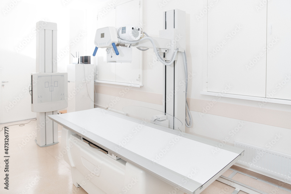 X-ray department in modern hospital. Radiology room with scan machine ...