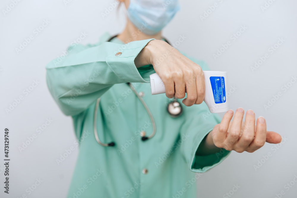 Temperature measurement gun in doctor hands. Close-up shot of doctor ...