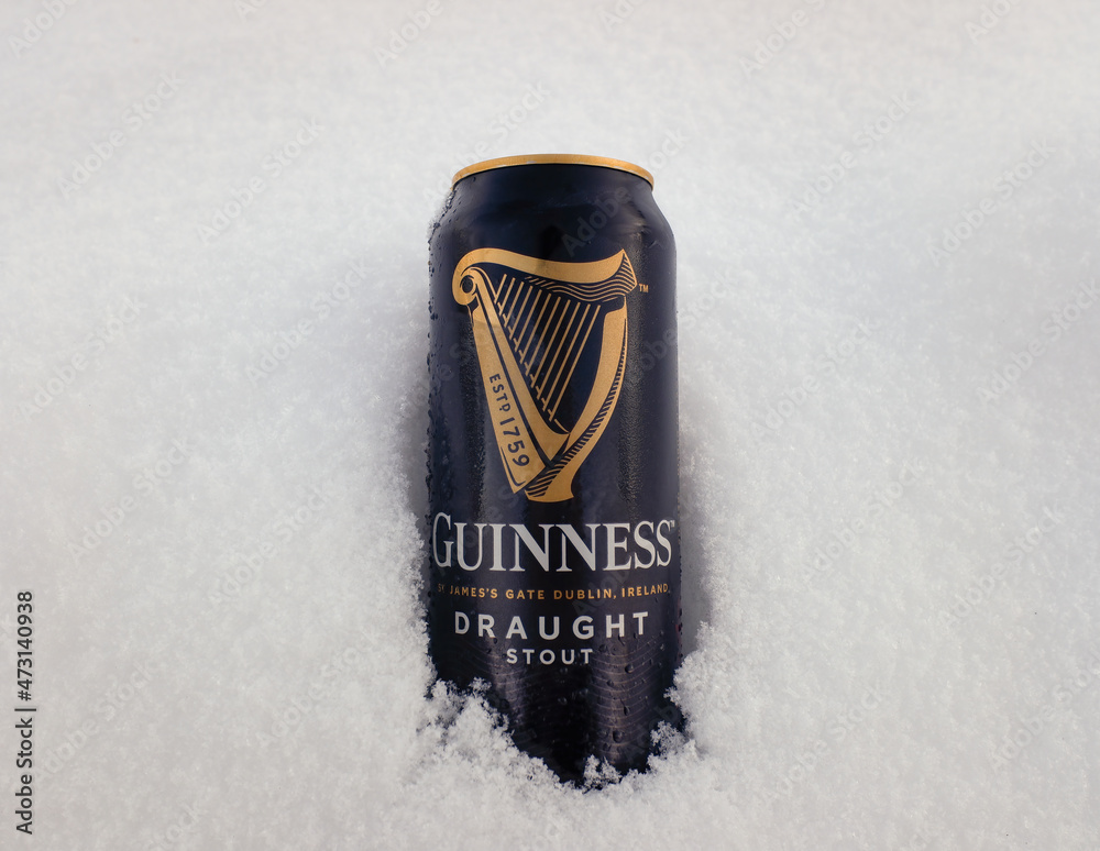 Can of Guinness draught Irish beer in snow, winter. Guinness is a ...