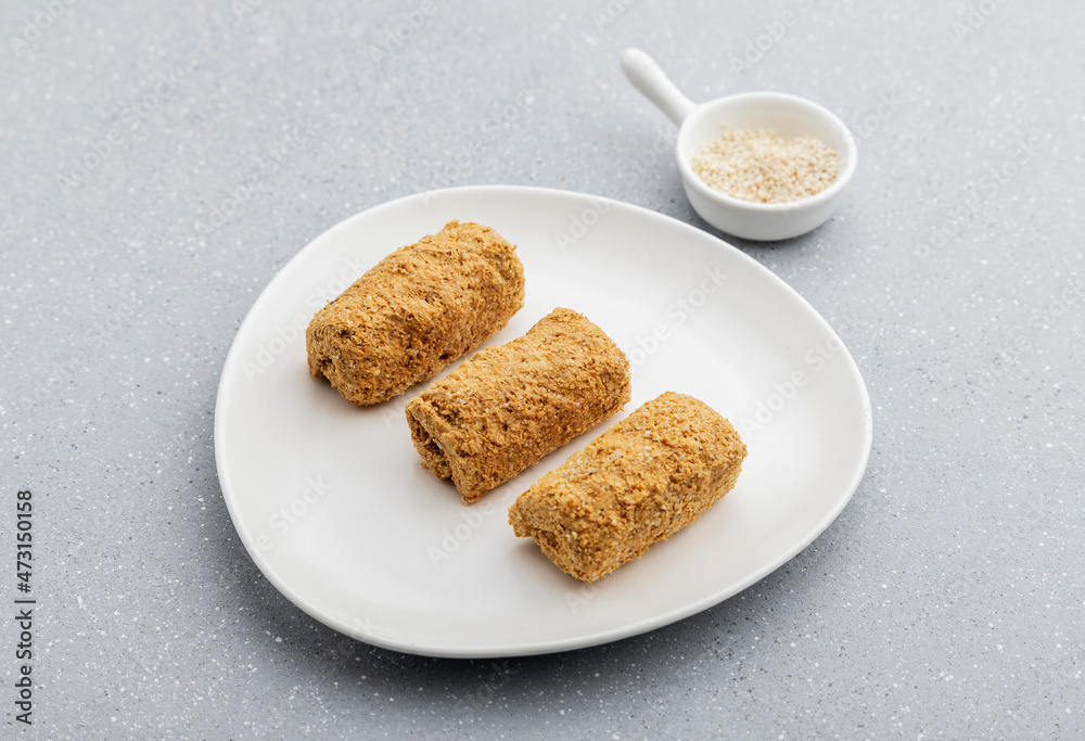 Gajak or til roll is a dry sweet rolls - made of sesame seeds, ground ...