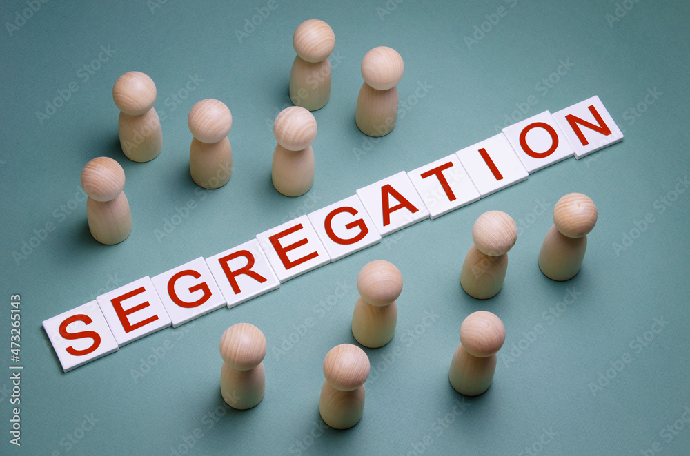 Separation of society concept. Wooden figurines and text on gray ...