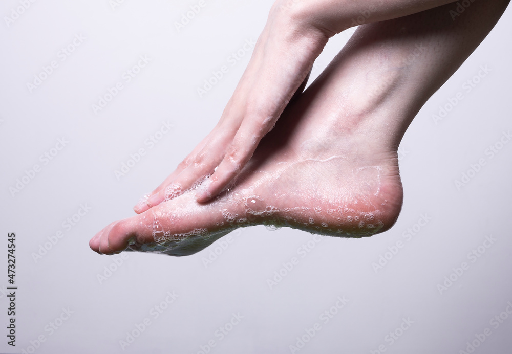 Washing your feet. Foam feet. Wash your feet with soap Stock Photo ...