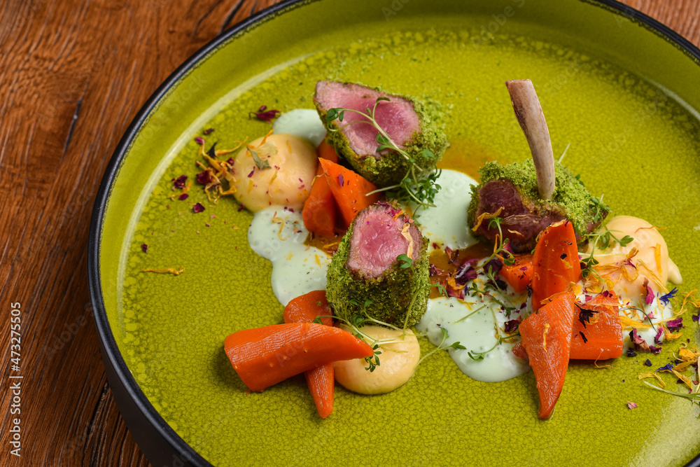 Fine dining, roasted Lamb chops with potato, rosemary and vegetable ...