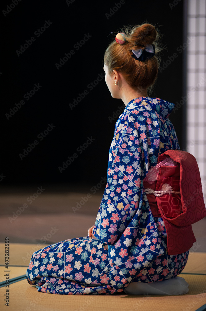 Woman in traditional kimono in kneeling position. Seiza is the formal ...
