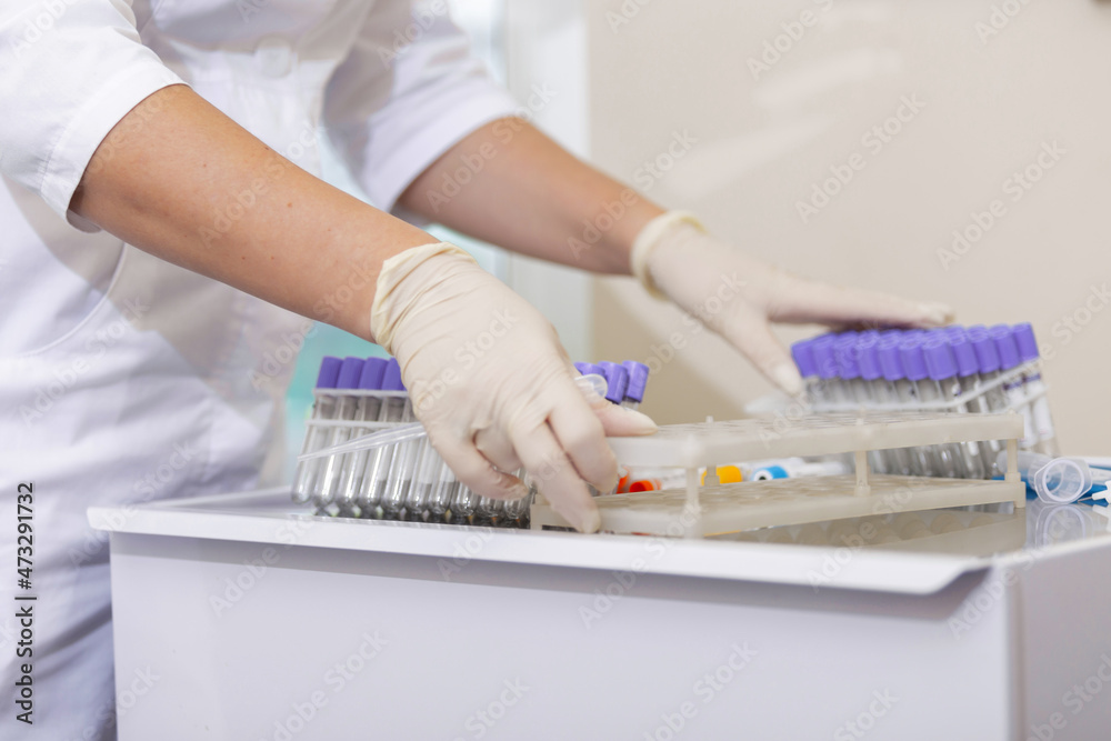 Test tube in scientist hand in laboratory. Doctor in uniform working ...
