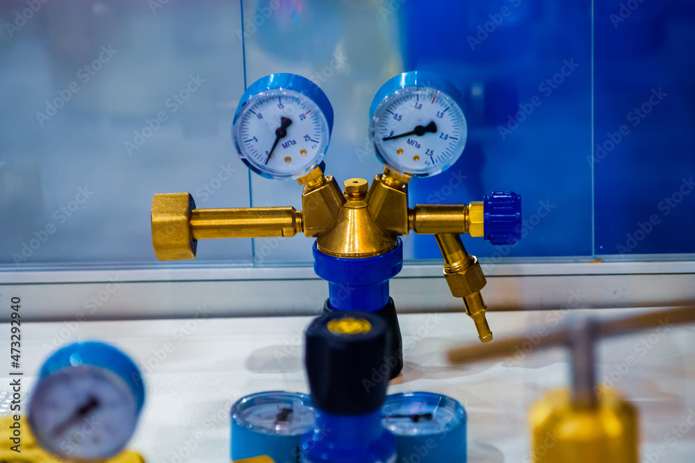Cylinder gas reducers with pressure gauge Stock Photo | Adobe Stock