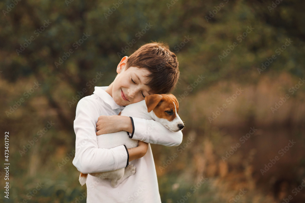 Child boy happy with presented puppy, children take care of animals ...