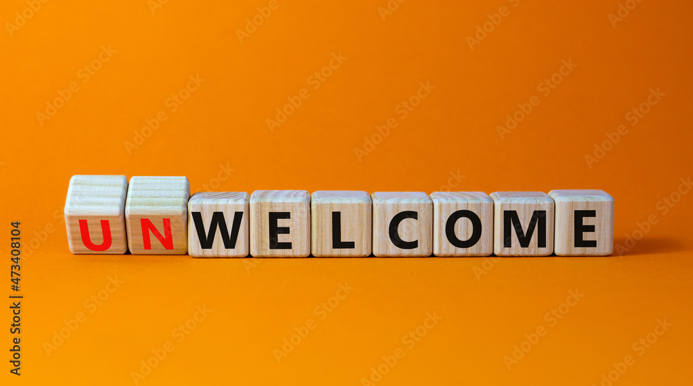 Welcome or unwelcome symbol. Turned wooden cubes and changed the word ...