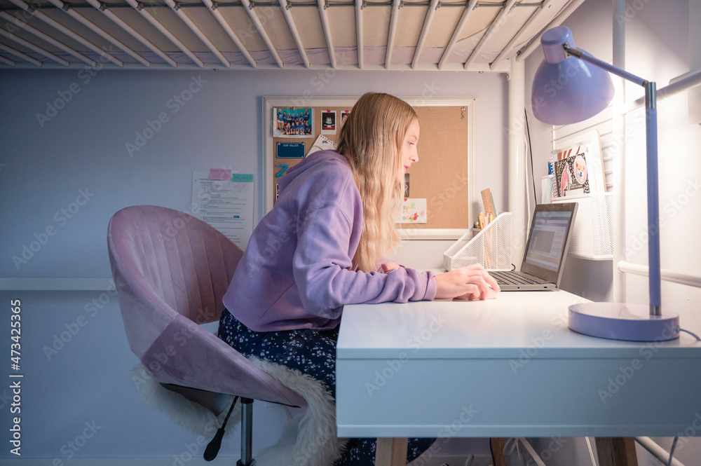 Tween Girl Sitting at Desk at Home Attending Remote School Stock Photo ...