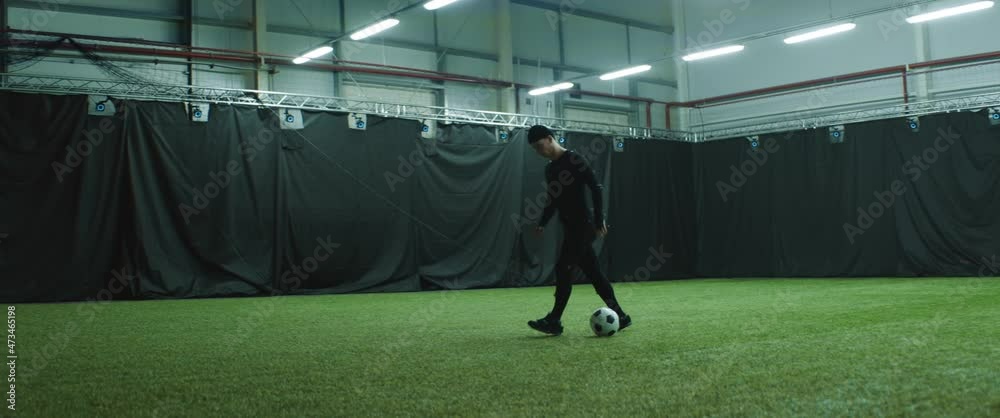 Soccer football player wearing motion capture suit performing kicks and ...