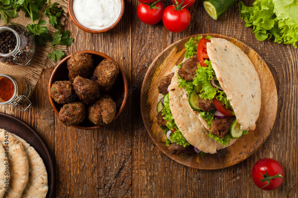 Kebab, kofta in pita, bun. Traditional southern European dish. Top view ...