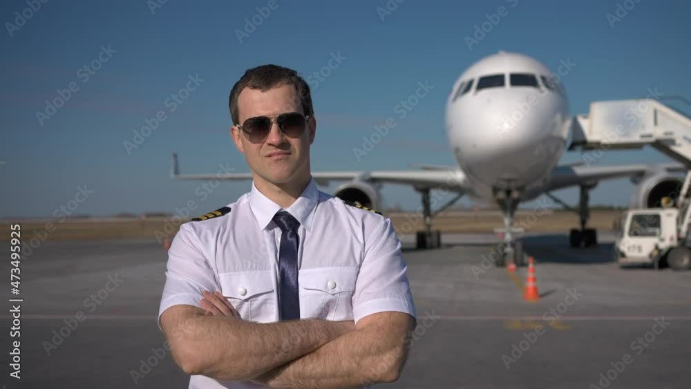 Video „Airport, pilot, airplane. Portrait of confident pilot in uniform ...