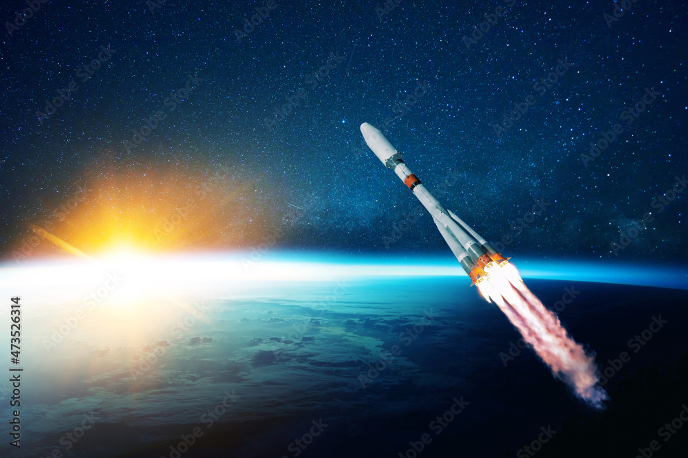 space rocket flies in the starry sky over the amazing blue planet earth ...