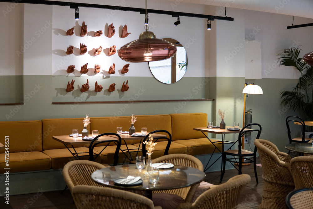 Hand sign models on wall with dining table in restaurant Stock Photo ...