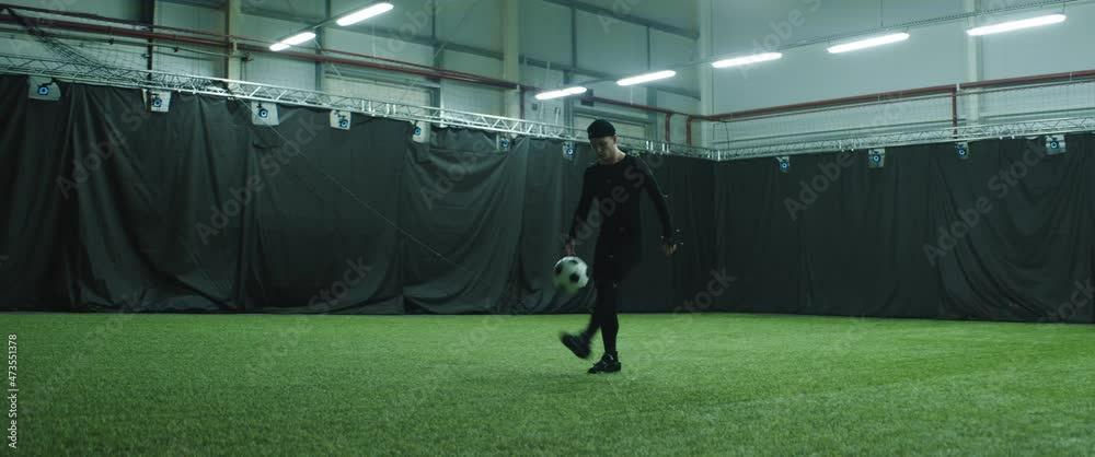 Soccer football player wearing motion capture suit performing tackles ...