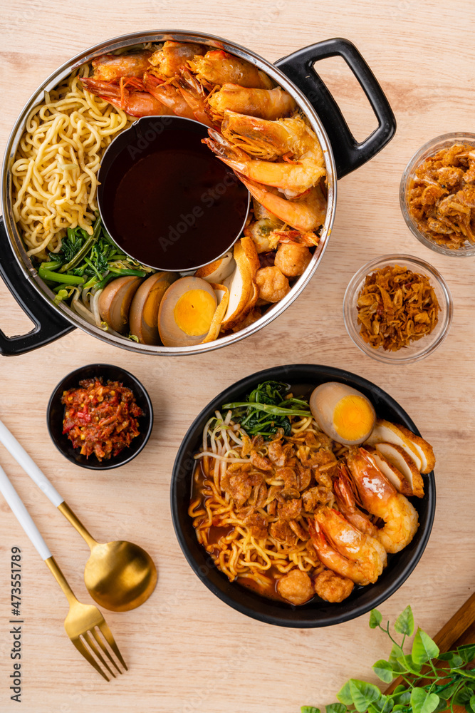 Hokkien mee or Prawn noodle are tossed in pork lard and served with ...