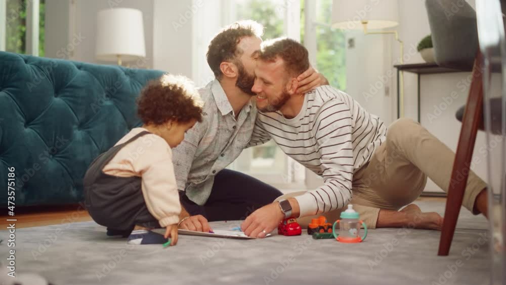 Loving LGBTQ Family Playing with Toys with Adorable Baby Boy at Home on ...