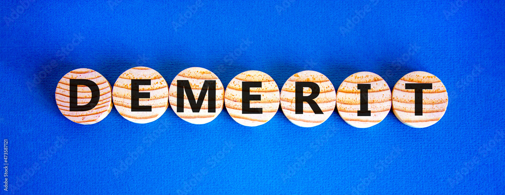 Demerit symbol. The concept word Demerit on wooden circles. Beautiful ...