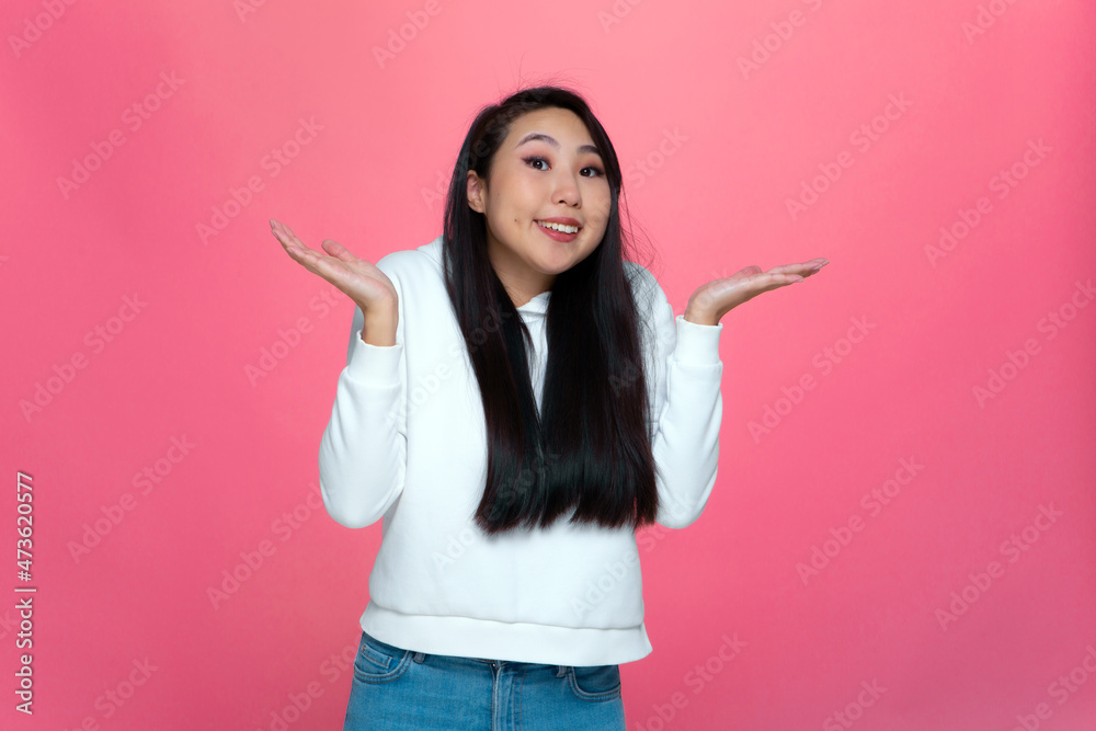 Smiling pretty young asian girl dont know answer, gesturing spread ...